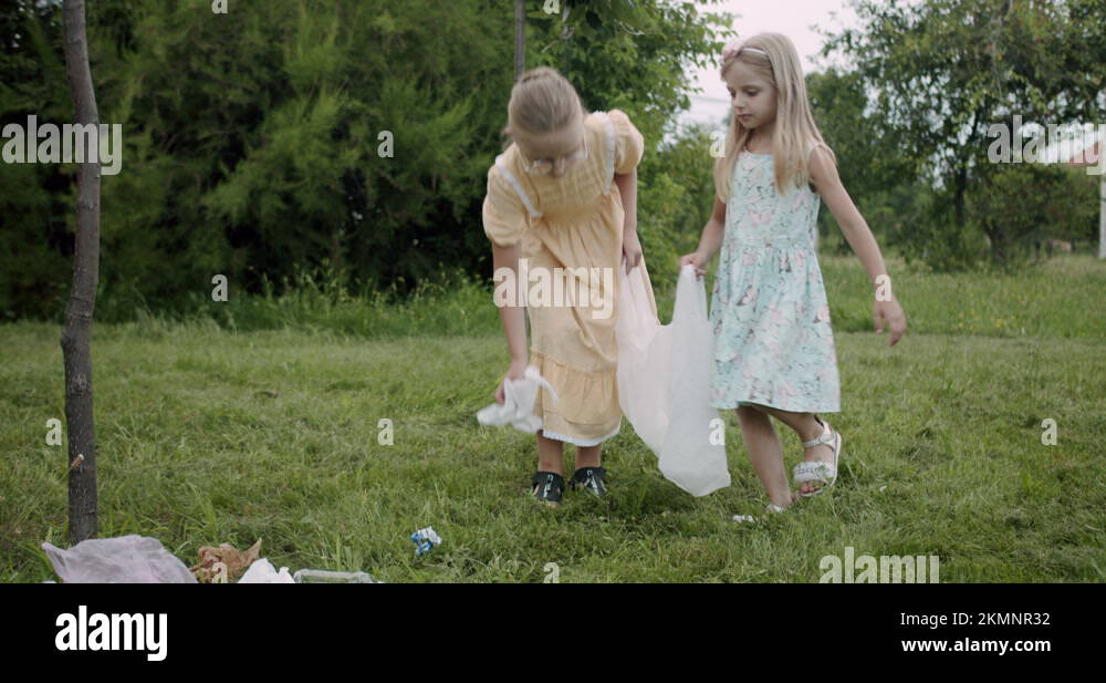 Activist Protect nature little girls collect plastic and trash in a ...