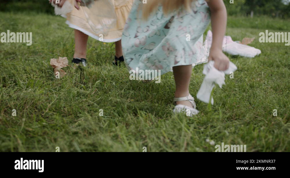 cleaning of nature little girls collect plastic and trash in a trash ...