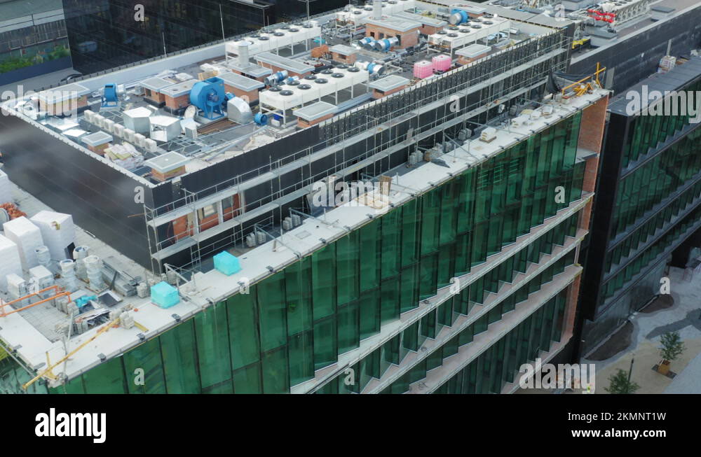 Office building with a glass facade under construction in downtown of ...