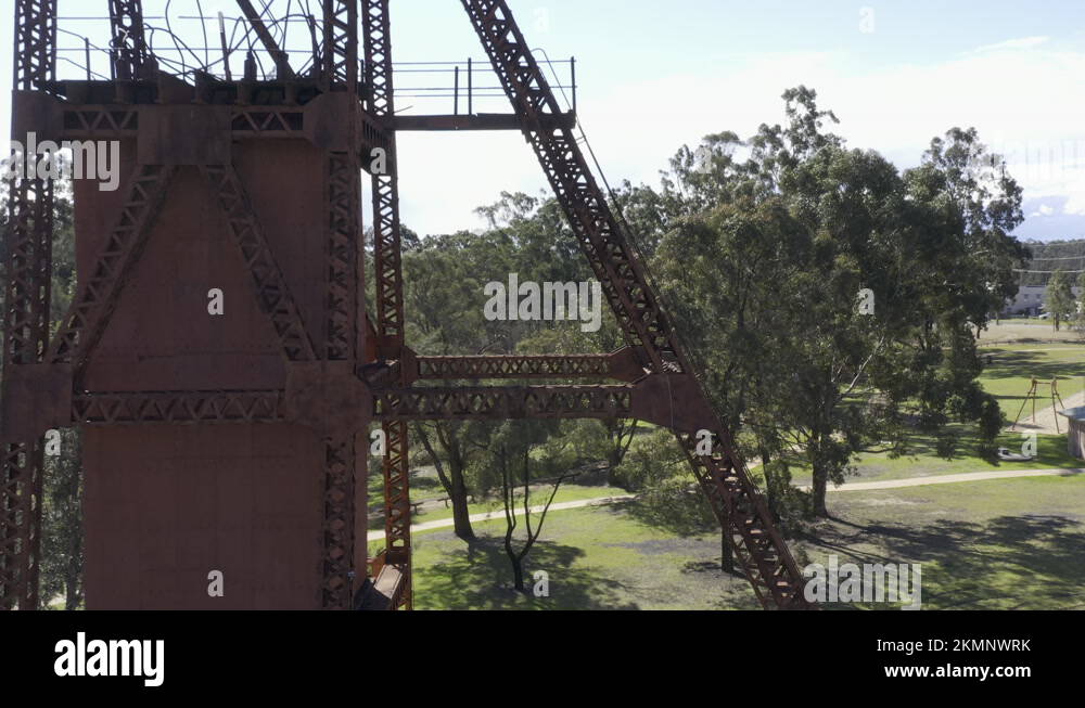 Drone aerial of apocalyptic historic abandoned coal mine near park in ...
