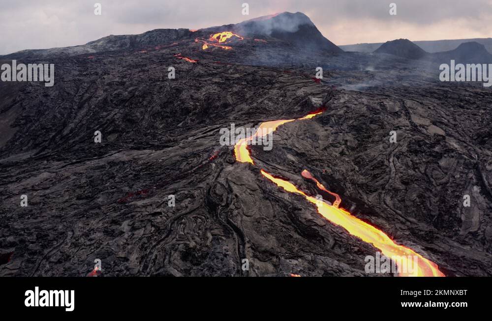 Volcanic Eruption With Flowing And Glowing Lava River - aerial drone ...