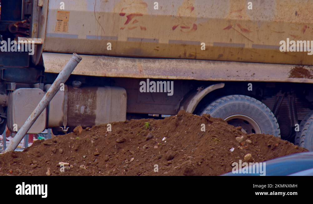 Excavator digging dirt in pile. Construction site and industry of ...