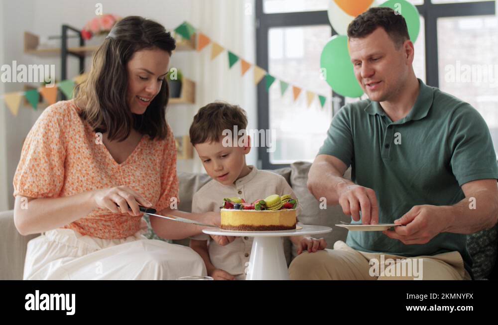 happy family sharing birthday cake at home Stock Video Footage - Alamy