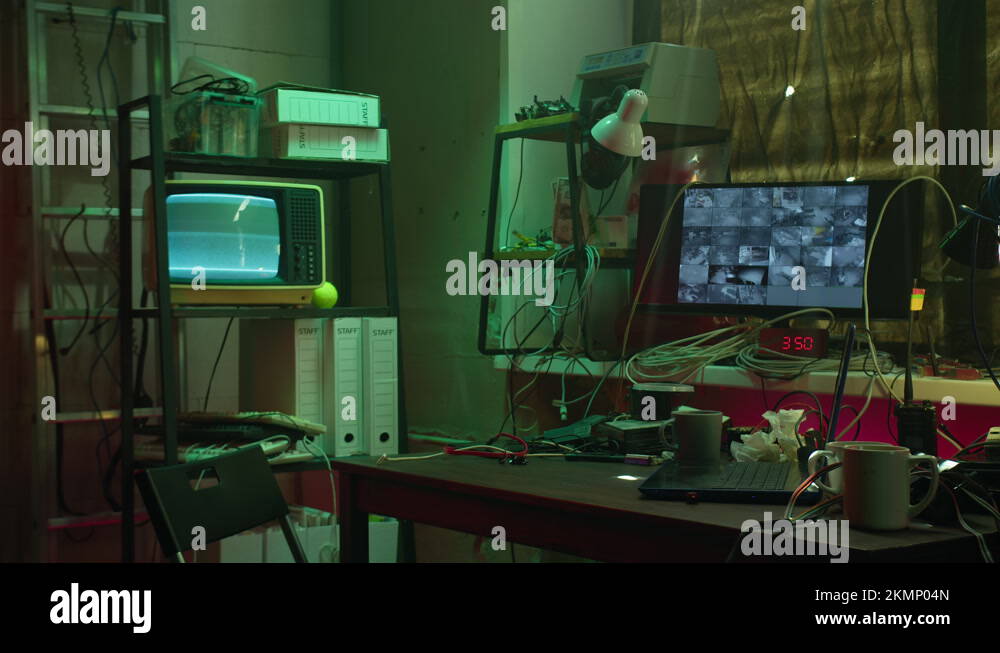 Shooting of hacker room. Video surveillance system on monitor screen ...