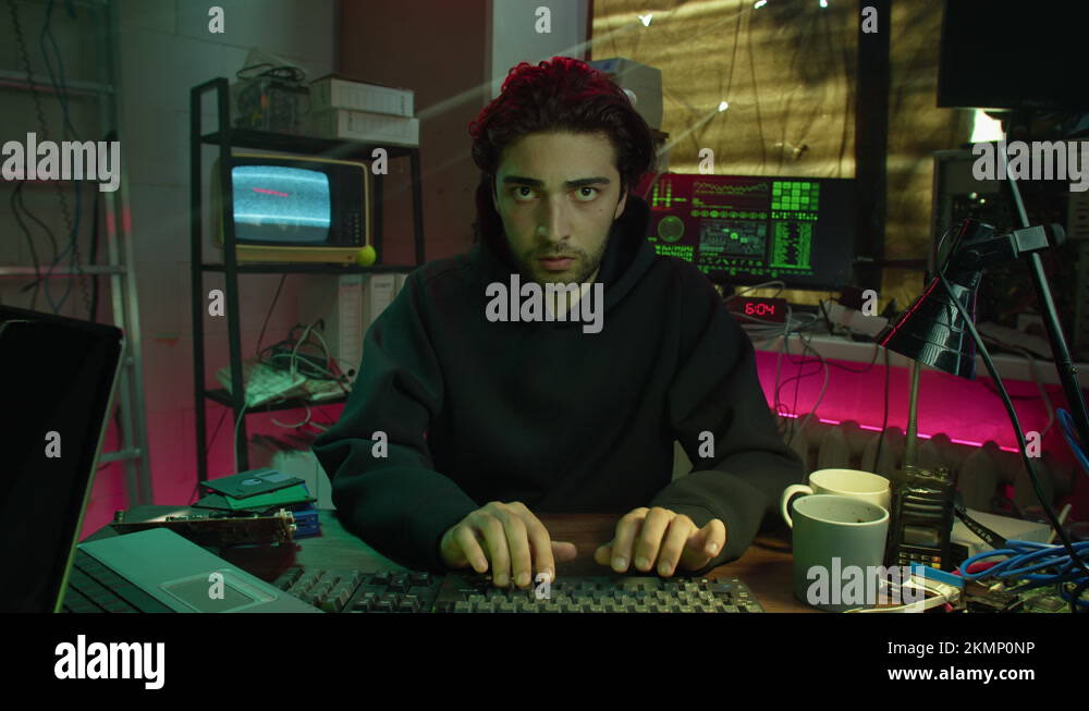 Careful hacker stealing information from laptop, preparing to break ...