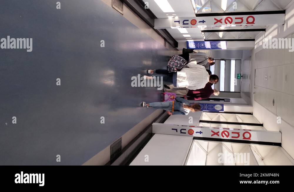 Tourists walking inside jet bridge connected to airplane in Antalya ...