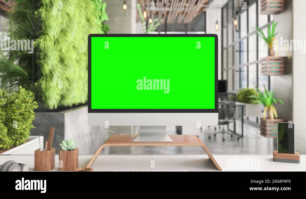 Green Computer Screen On Modern Office Desk In Sustainable Green Co ...