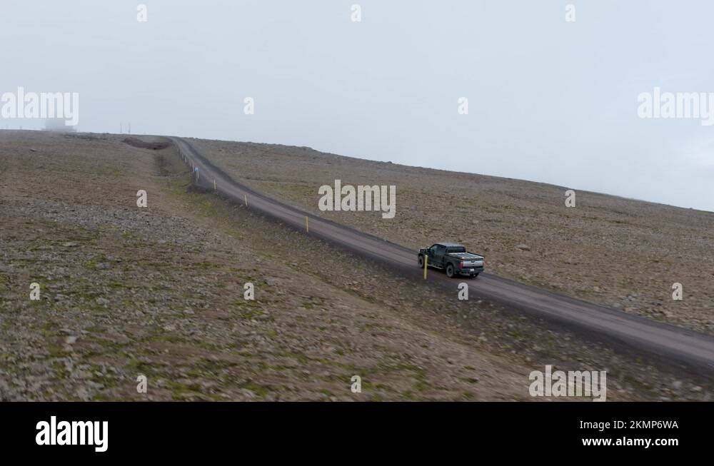 Pickup Truck Driving On An Uphill Mountain Road At Westfjords Region In ...