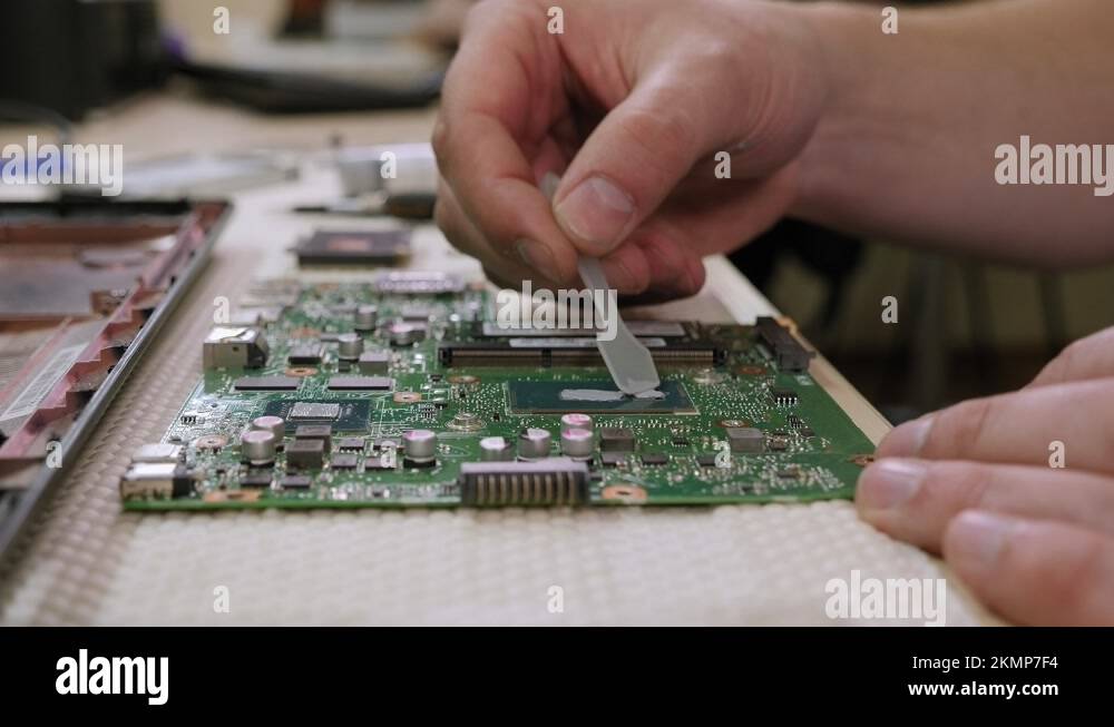 Applying thermal paste to the laptop processor Stock Video Footage - Alamy