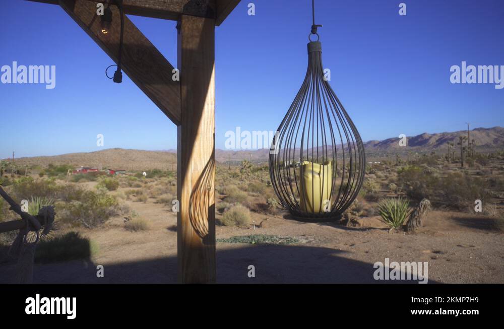 Swinging Candle Cage on Rustic California Desert Porch Stock Video ...