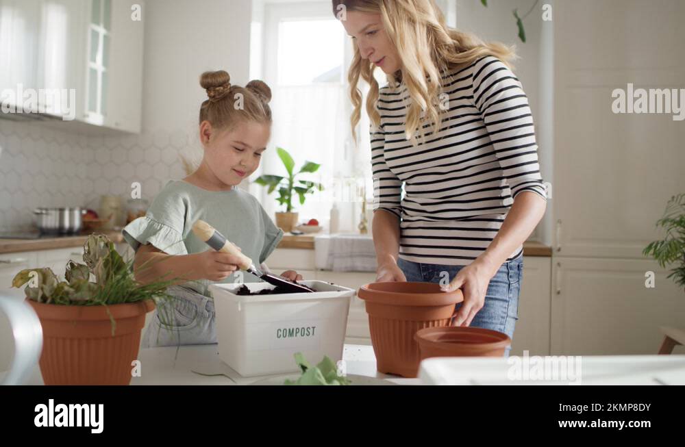 Video of mother and daughter doing compost Stock Video Footage - Alamy