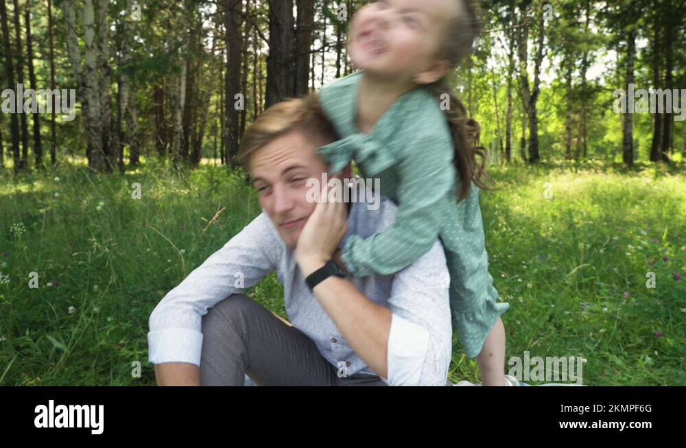 5-year-old girl does not let her dad be sad. Father and little daughter ...