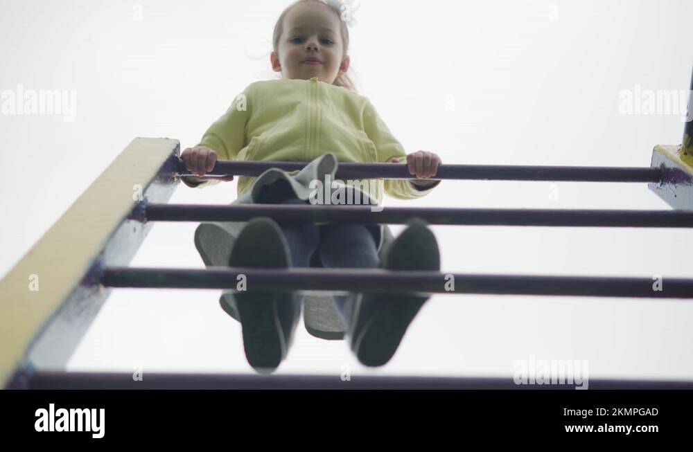 Cute pretty Preschool children climb stairs on playground. Little girl ...