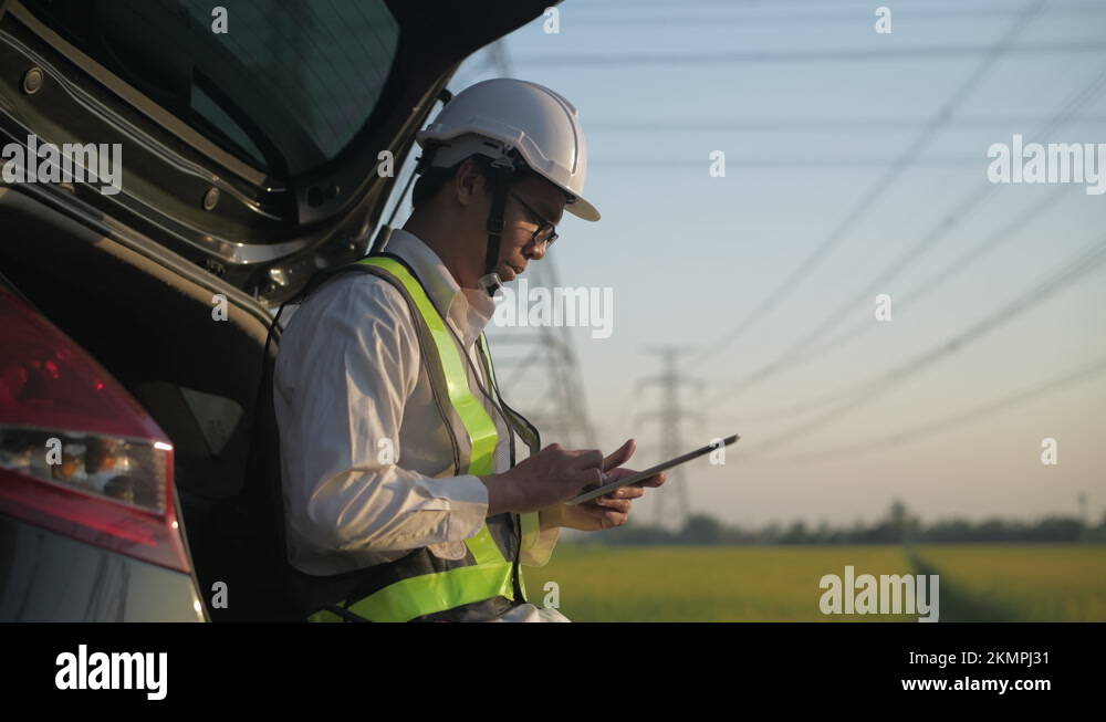 Engineer concept of 4k Resolution. An employee is using a tablet to ...