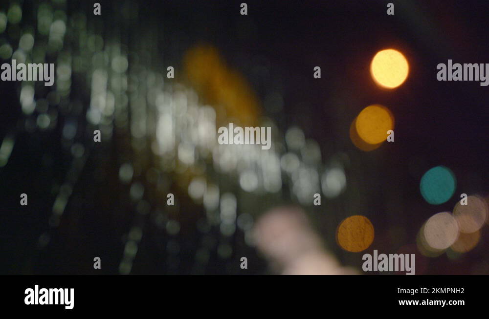 Looking through broken glass window revealing blurred, dark and scary ...