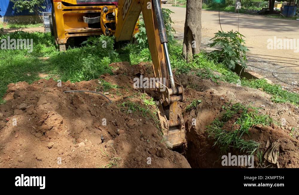 JCB excavator working at construction site, jcb backhoe loader working ...