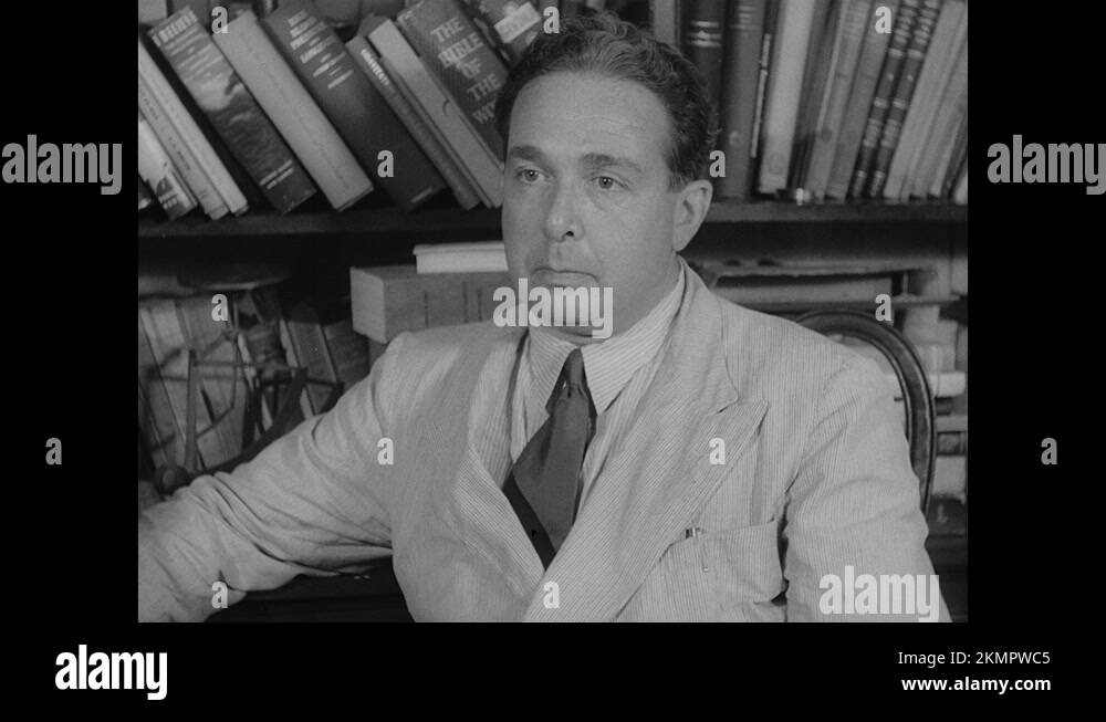 1940s: Leo Szilard sits in chair. Two people enter store front, person ...