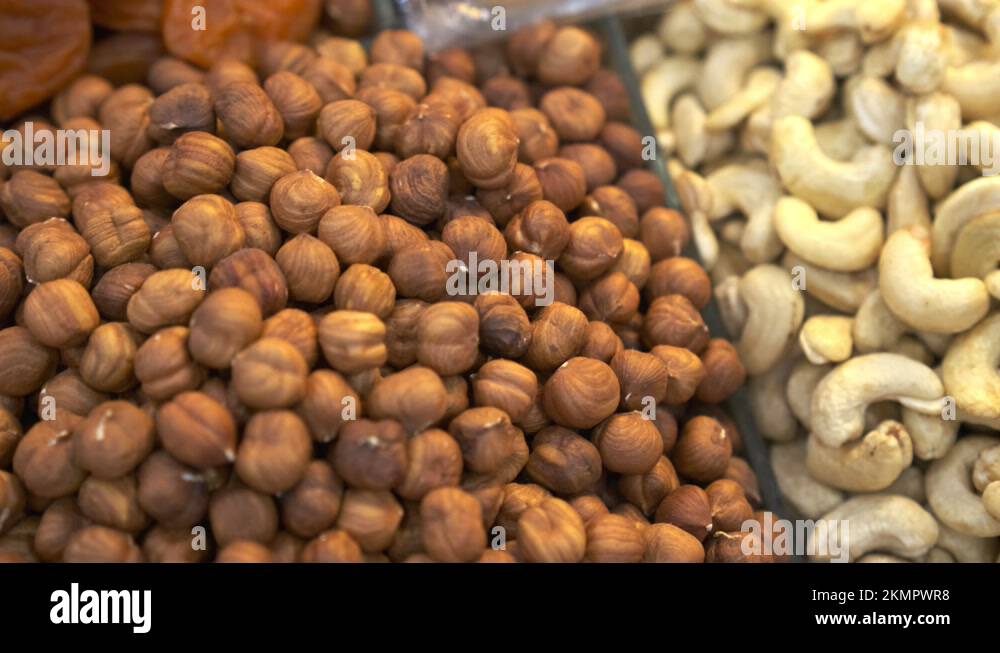 Large Counter of Dried Fruits and Nuts at a Farmers Market . Nuts, dry ...