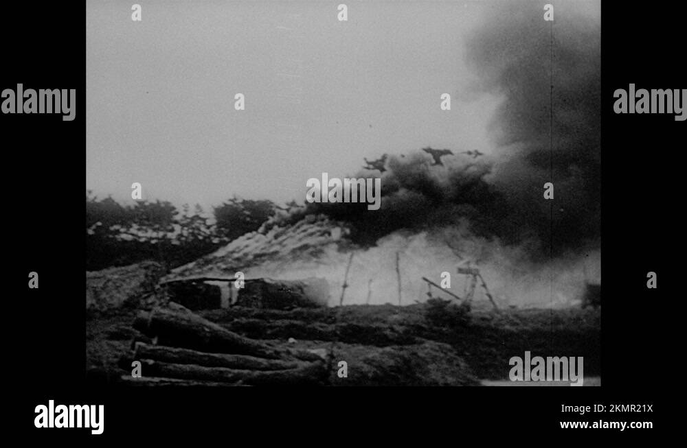 1940s: Soldier wields flamethrower. Fire burns house and field ...