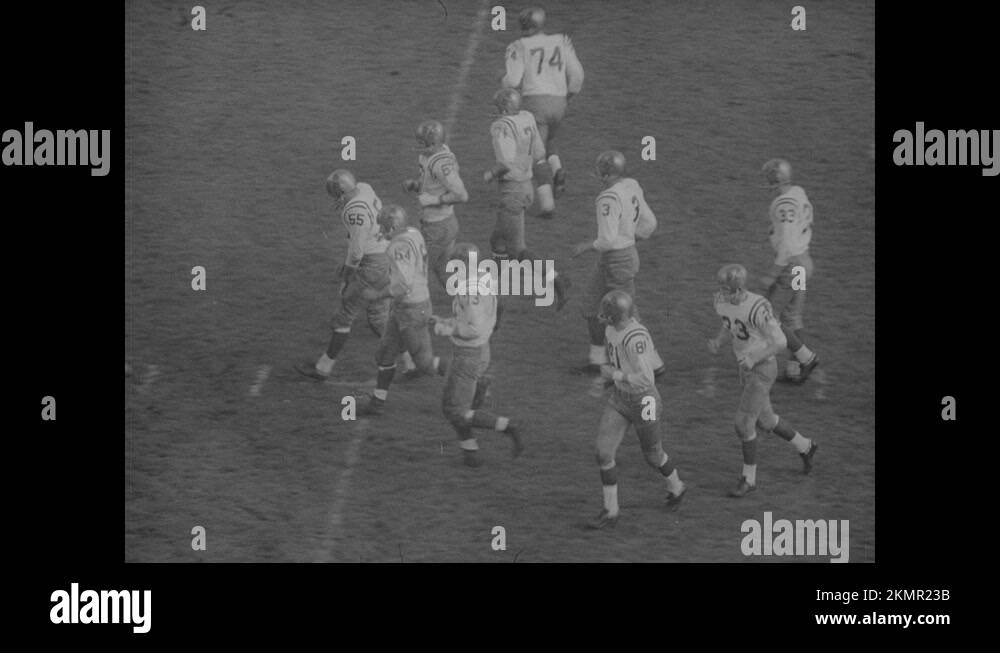 1960s: Football team huddles on field, plays game. Amos Alonzo Stagg ...