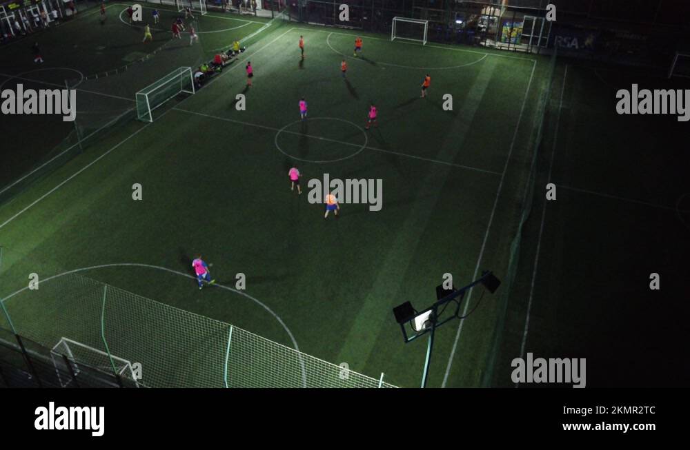 Fly over soccer stadium and the game in a night time Stock Video ...