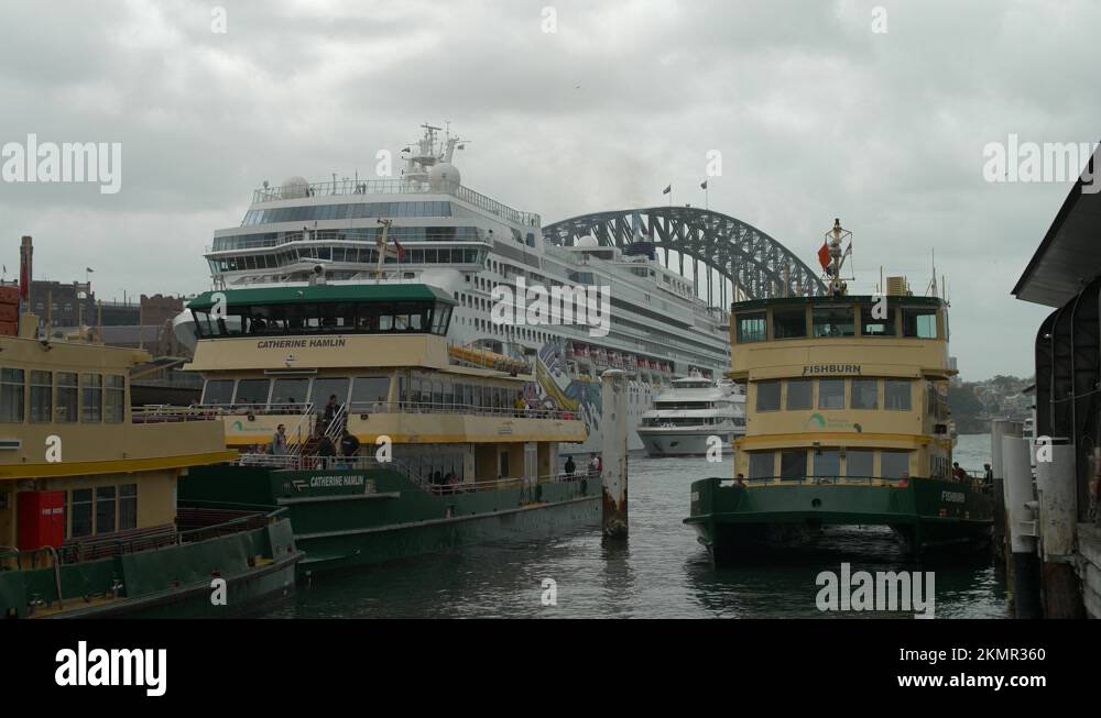 Norwegian Jewel and Sydney ferries docked at Circular Quay slow motion ...