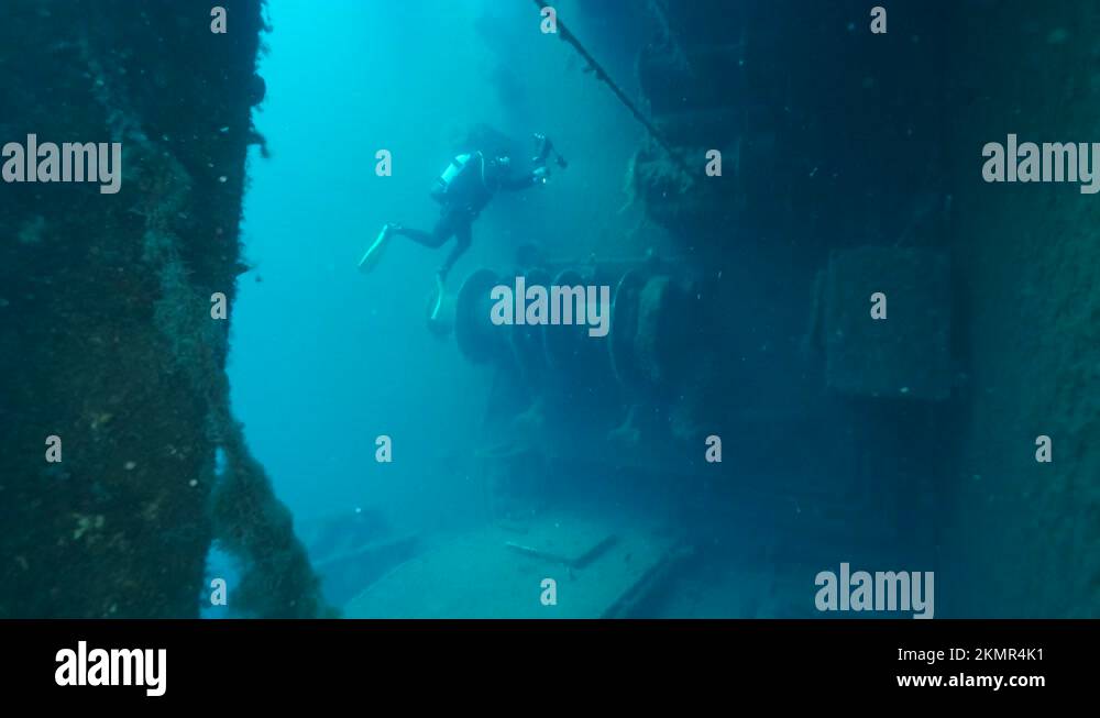 Cameraman takesshots the car on shipwreck Swedish ferry MS Zenobia ...