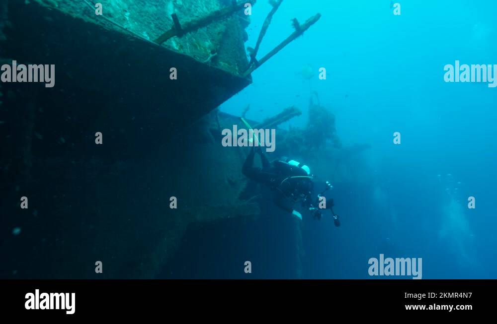 Scuba diver photographer swims on th shipwreck Swedish ferry MS Zenobia ...
