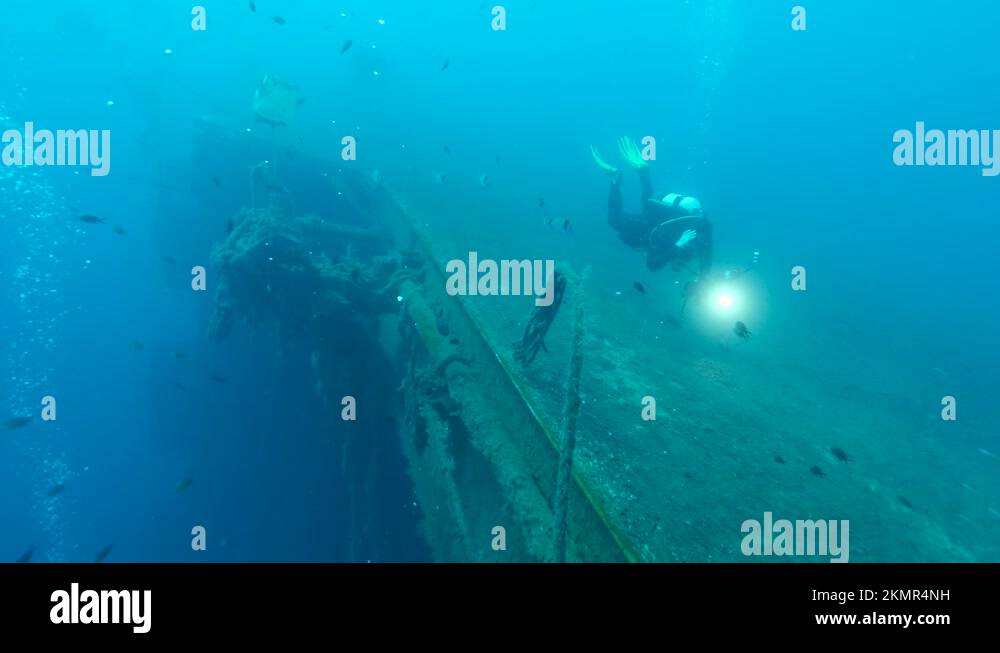 Scuba diver photographer swims on th shipwreck Swedish ferry MS Zenobia ...