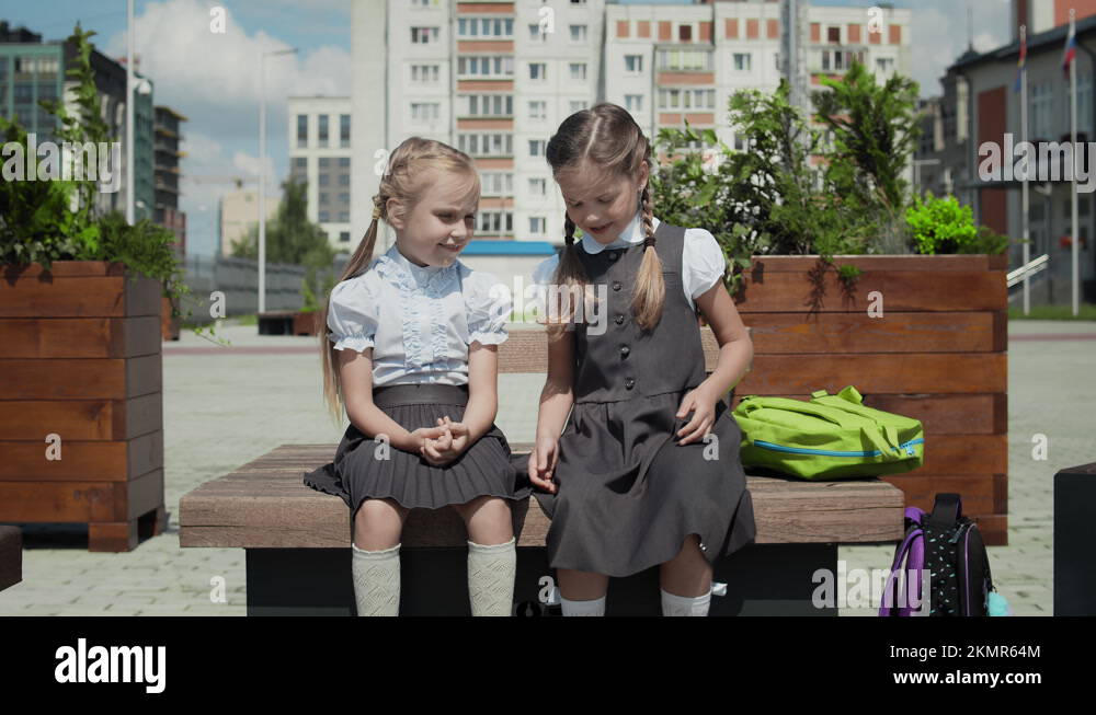Two little girls talking at schoolyard Stock Video Footage - Alamy