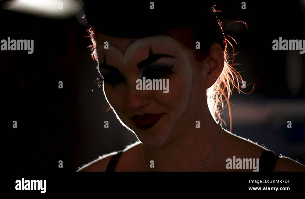 Horror scene - clown woman smiling in a dark and scary basement Stock ...