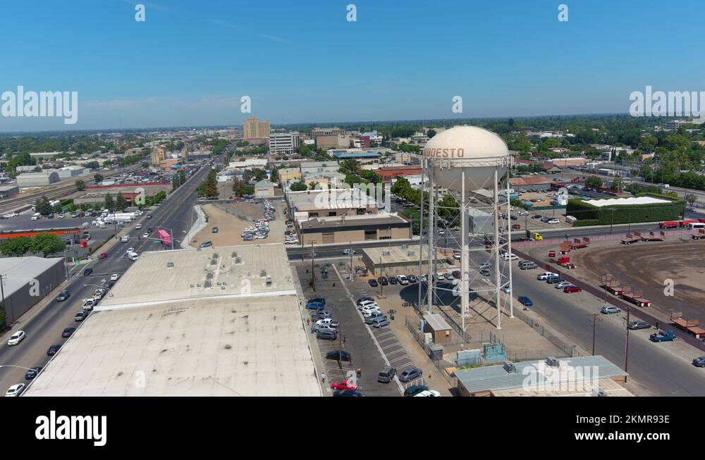 2021 - establishing aerial of Merced, California watertank and downtown ...