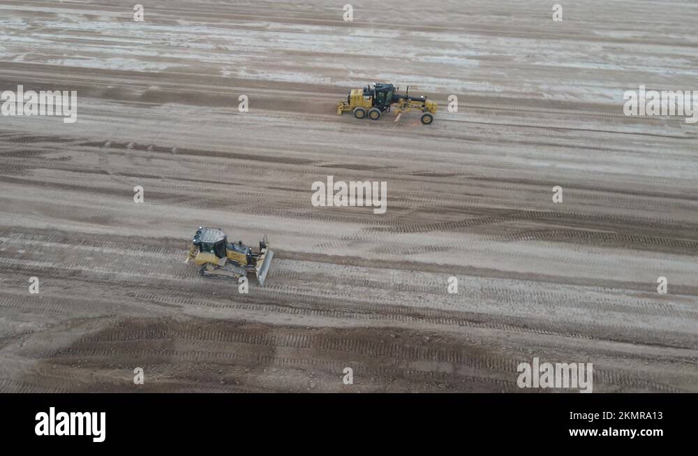 Bulldozer and scraper tractors working side by side in a landfill. 4k ...