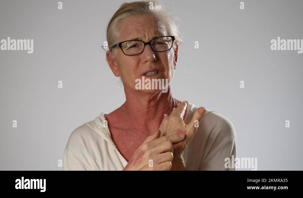 Woman complaining about skin rash problem on her neck and chest on ...