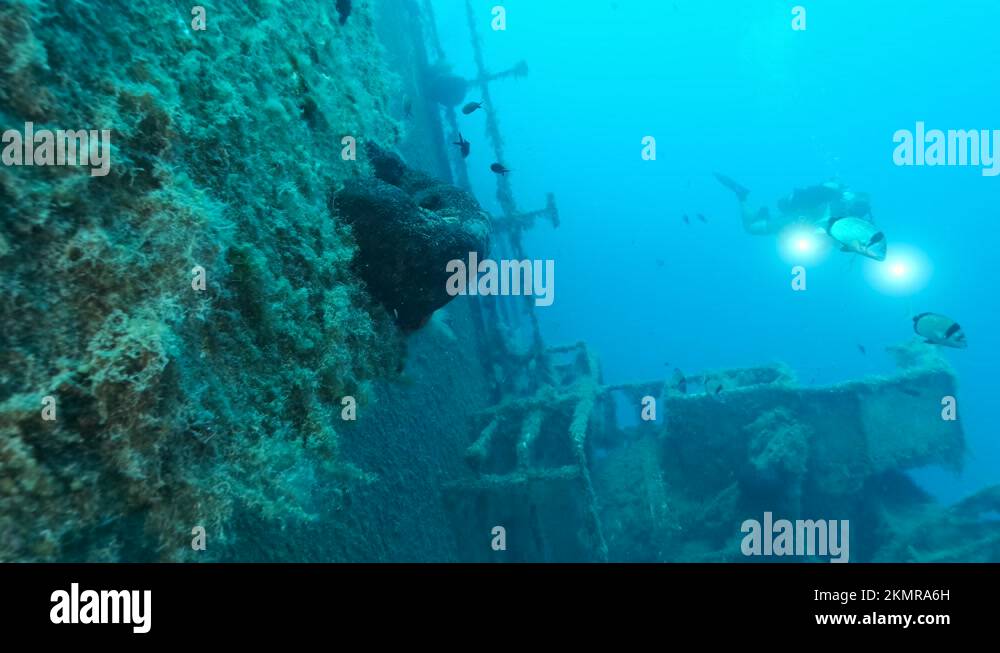 Scuba diver photographer swims on the Shipwreck Swedish ferry MS ...