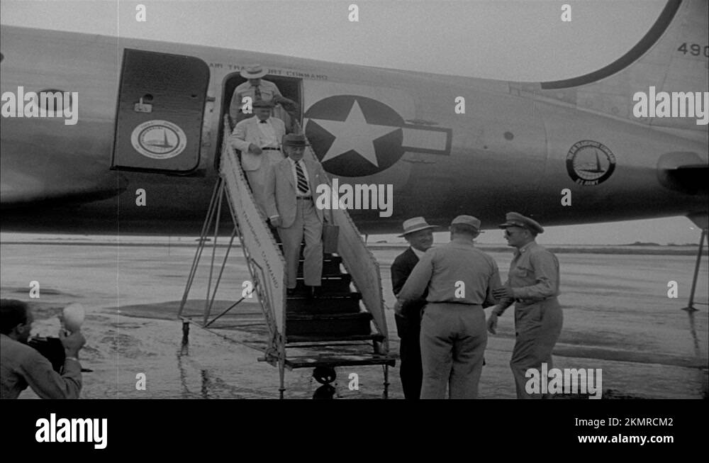 1940s: Men in suits descend Air Transport Command plane steps and shake ...
