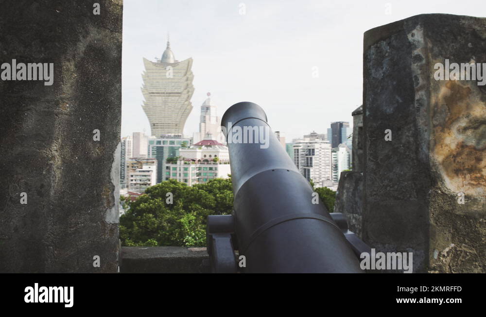 Macau - Cannon on the ramparts of the Monte Forte with the Grand Lisboa ...
