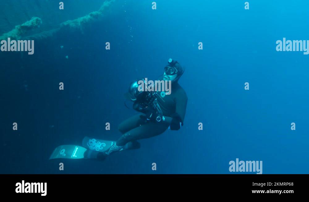 Free diver photographer swims on the shipwreck Swedish ferry MS Zenobia ...