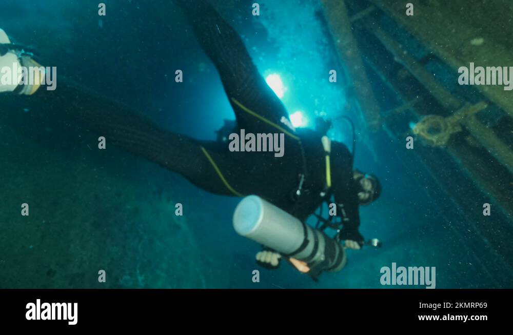 Scuba diver swims inside of the shipwreck Swedish ferry MS Zenobia ...
