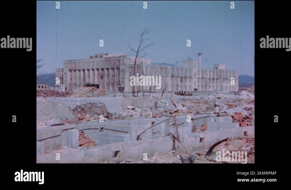 1940s: Large building surrounded by debris. Scrap metal and melted ...