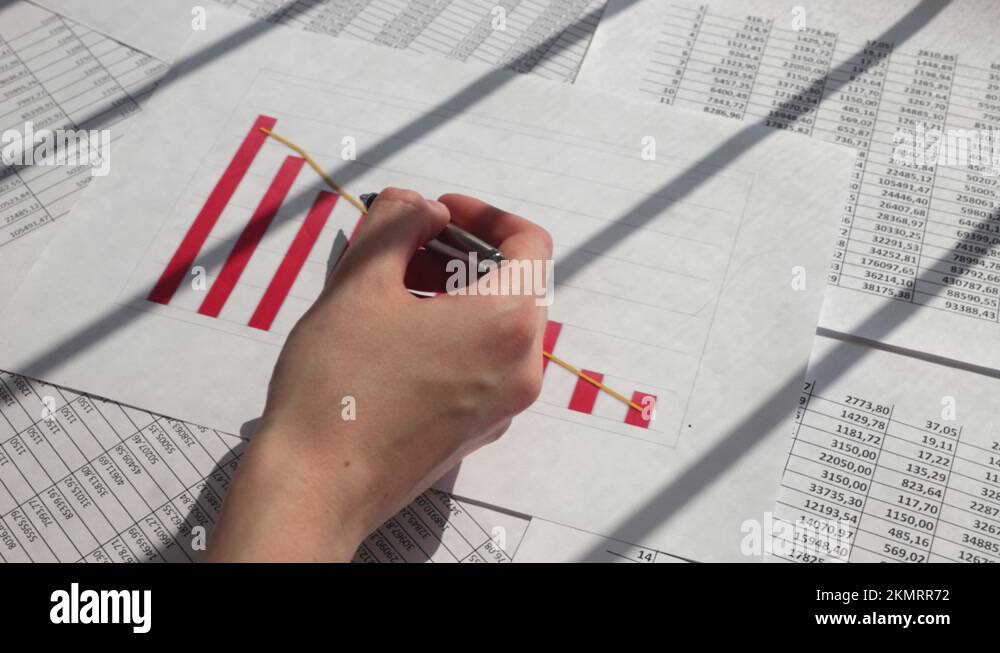 Crisis concept. Hand and graph chart with falling trend of red color ...