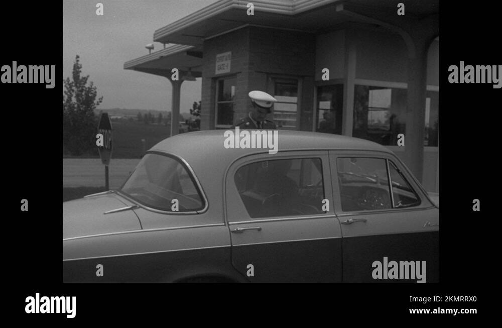 1960s: Sentry at front gate of Offutt Air Force Base stops a car ...