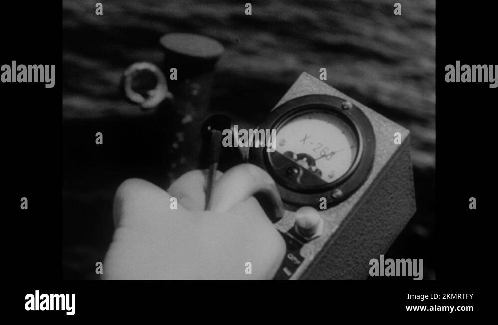 1940s: Men adjust and use Geiger counters on deck of ship. Soldiers ...