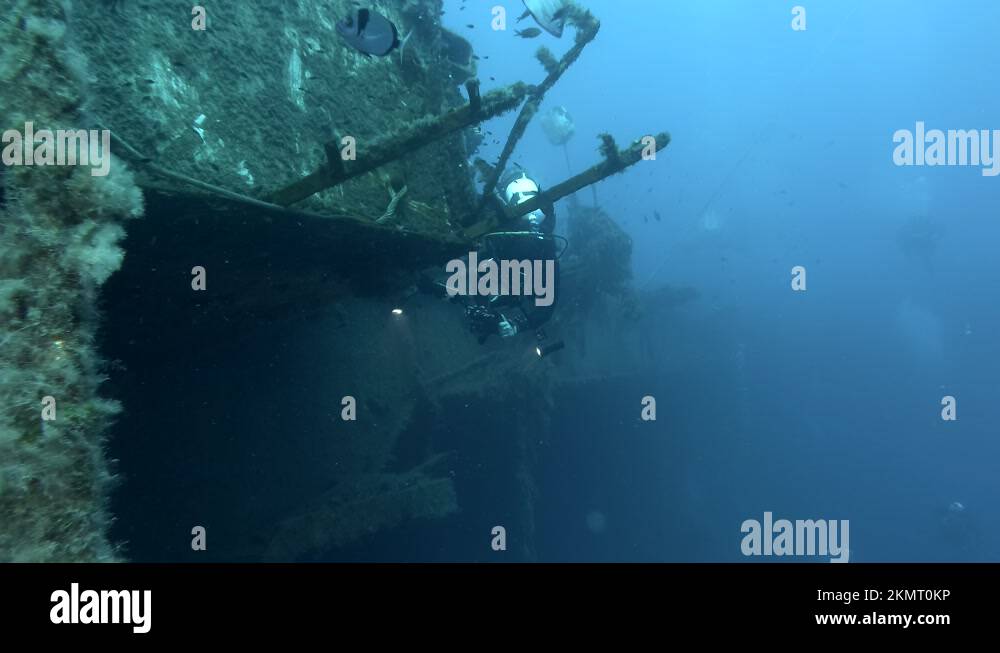 Scuba divers swims on the Shipwreck Swedish ferry MS Zenobia. Wreck ...