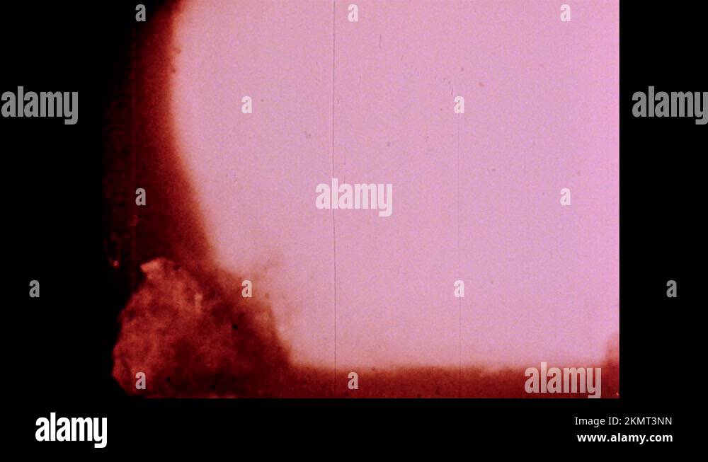 1960s: Atomic bomb explodes. Atomic fallout rains down from sky Stock ...