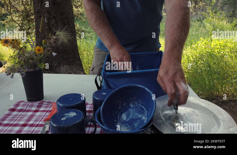 Caucasian Male Washing Dishes At Campgrounds Tedious Chore Stock Video Footage Alamy