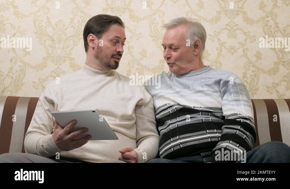 Happy family of two generations, father and son. Elderly father and ...