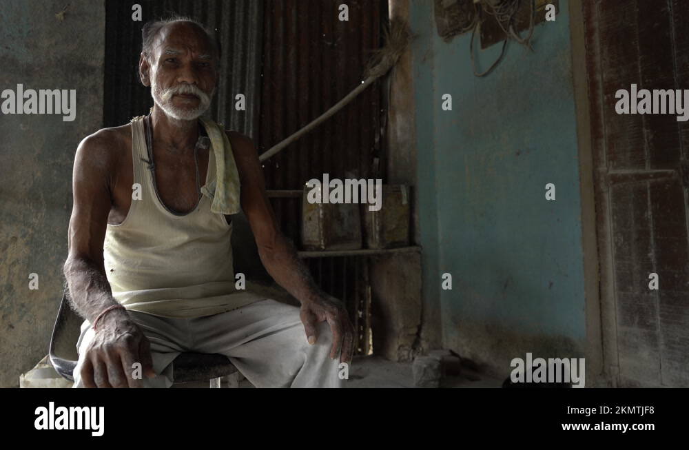 Indian old man sitting in dark room, India Stock Video Footage - Alamy