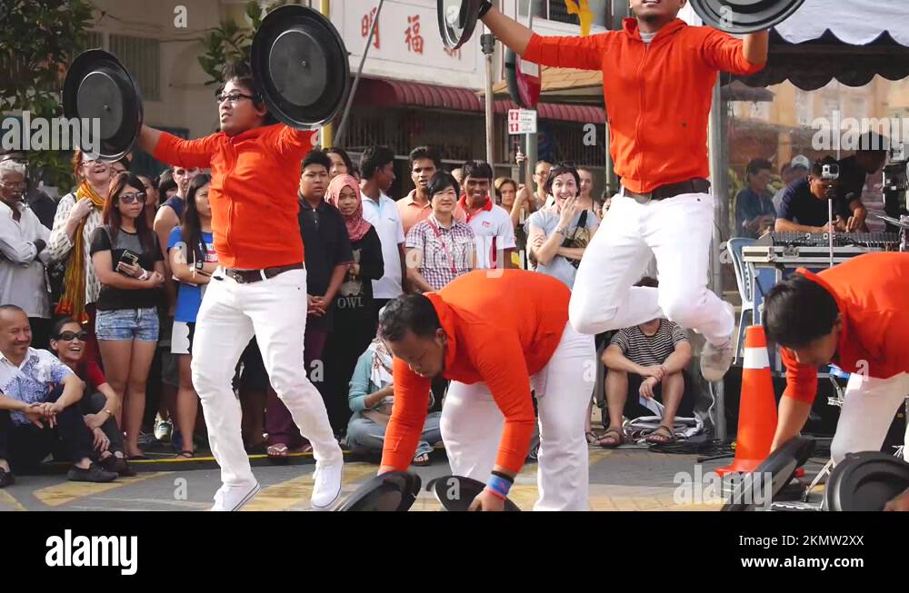 Asian Street Performers In Orange During Unique Performance - Penang ...