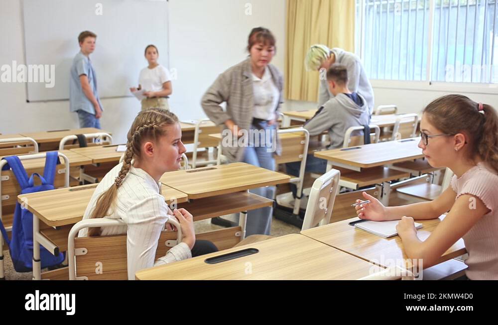 Three teenage girls talking and having fun, spending time together ...